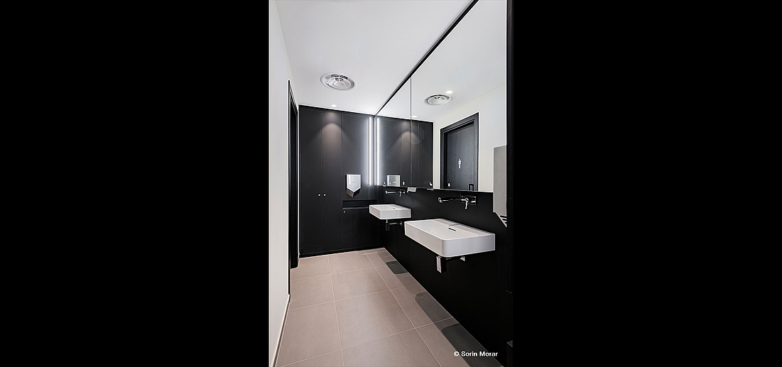 Office lighting with slim black luminaires by Luxsystem